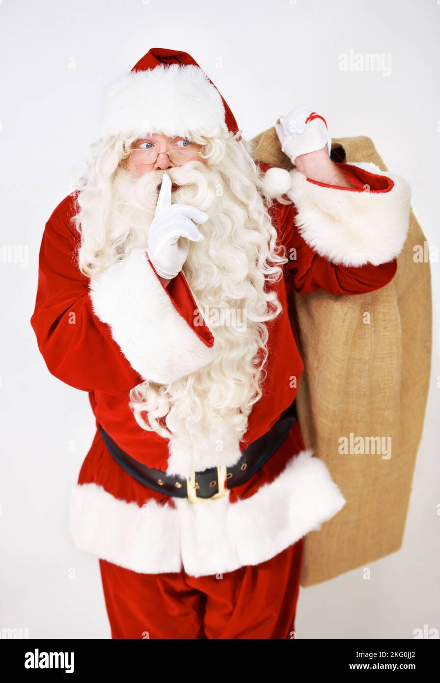 Secret, quiet and santa with christmas gift sack for silent holiday ...