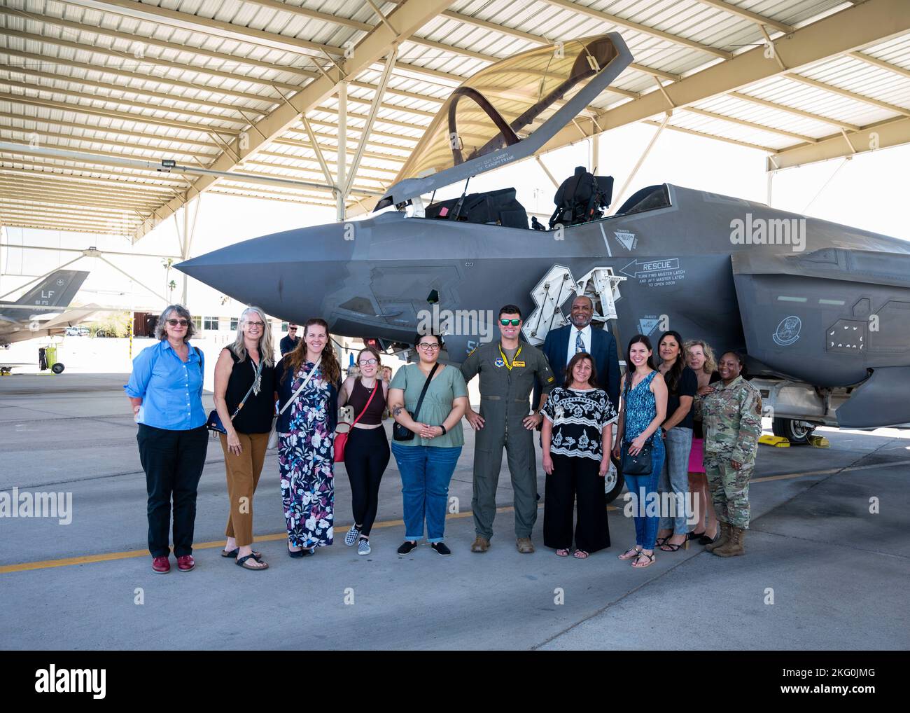 Participants of the Heart Link Spouse Orientation stand in front of a U ...