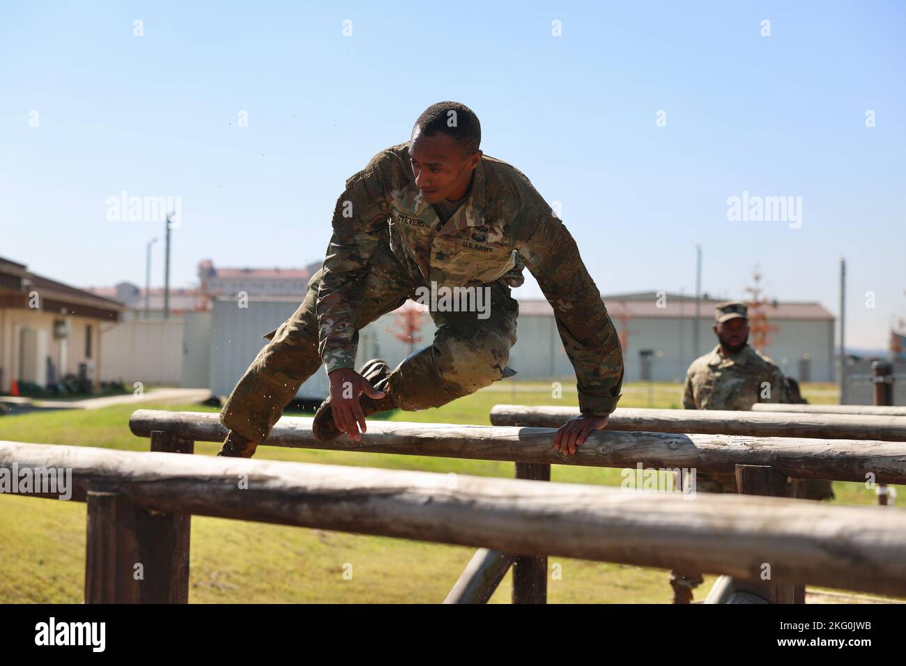First Sgt. Christopher Stevens vaults over a high hurdle obstacle at ...