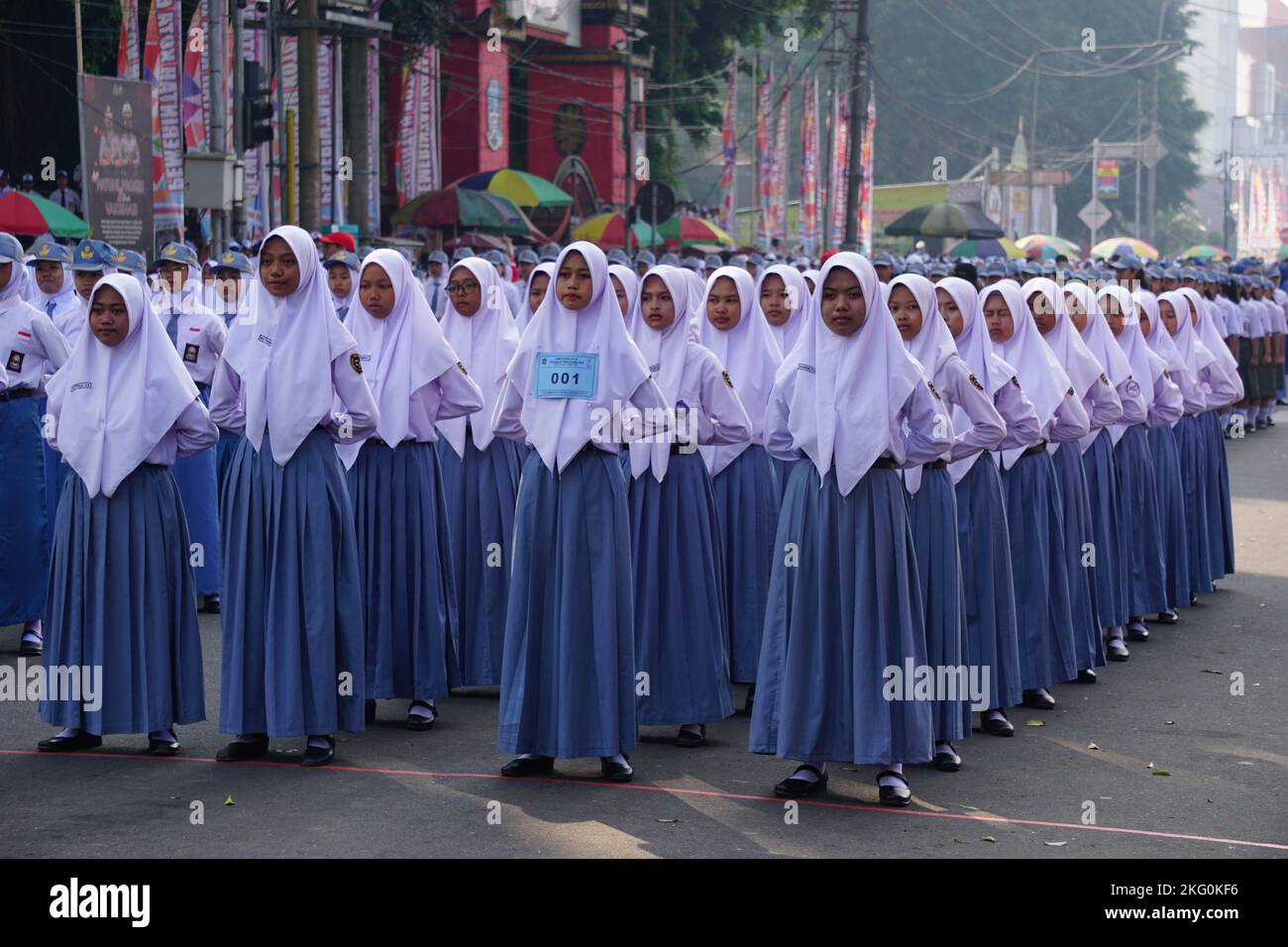Indonesian senior high school students with uniforms, marching to ...