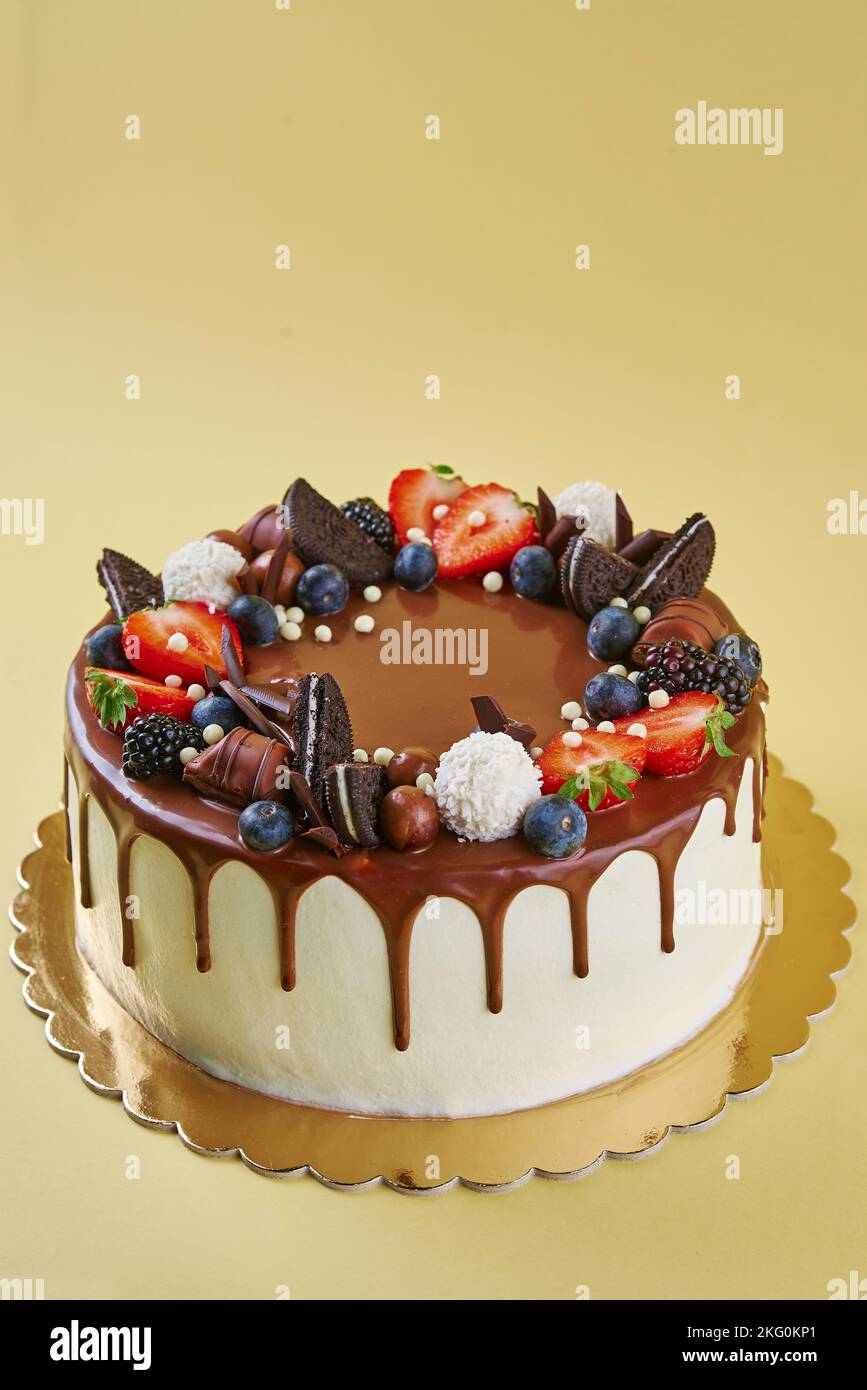 Birthday cake on yellow background. Close up of cake decorated with ...