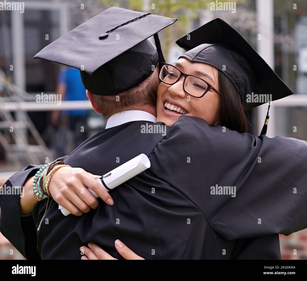 Graduation congratulations. two students hugging on graduation day Stock Photo - Alamy