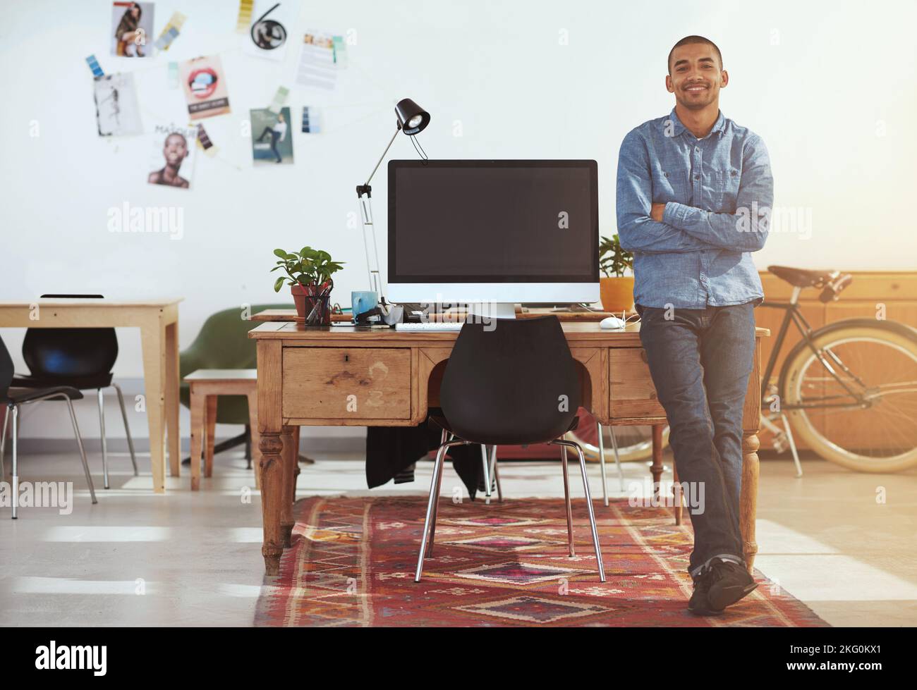 Meeting all my design deadlines. Portrait of a young male designer in ...