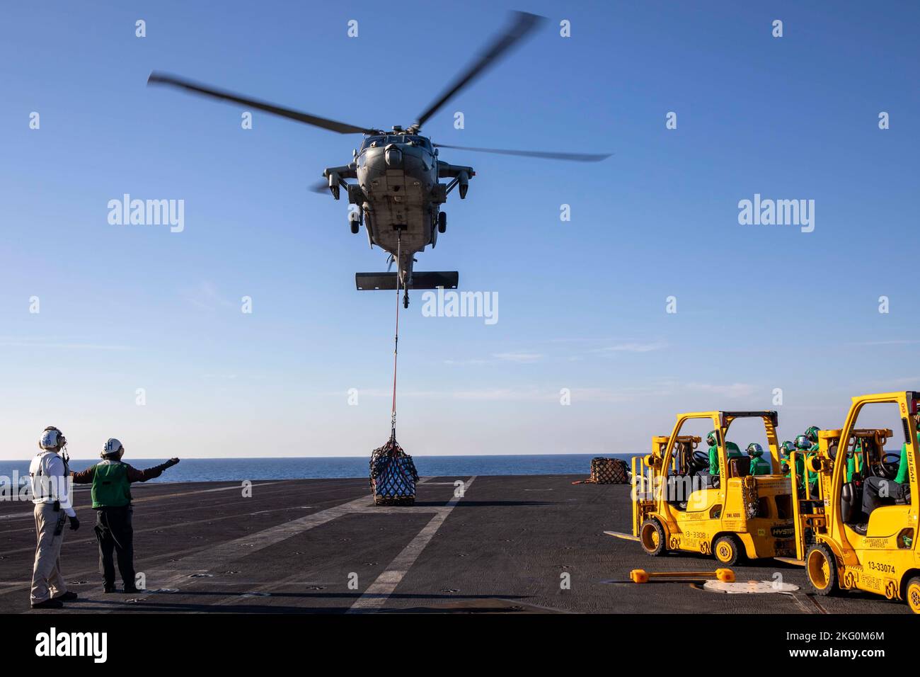 221020-N-ZG822-1259 ADRIATIC SEA (Oct. 20, 2022) A Sailor signals an MH ...