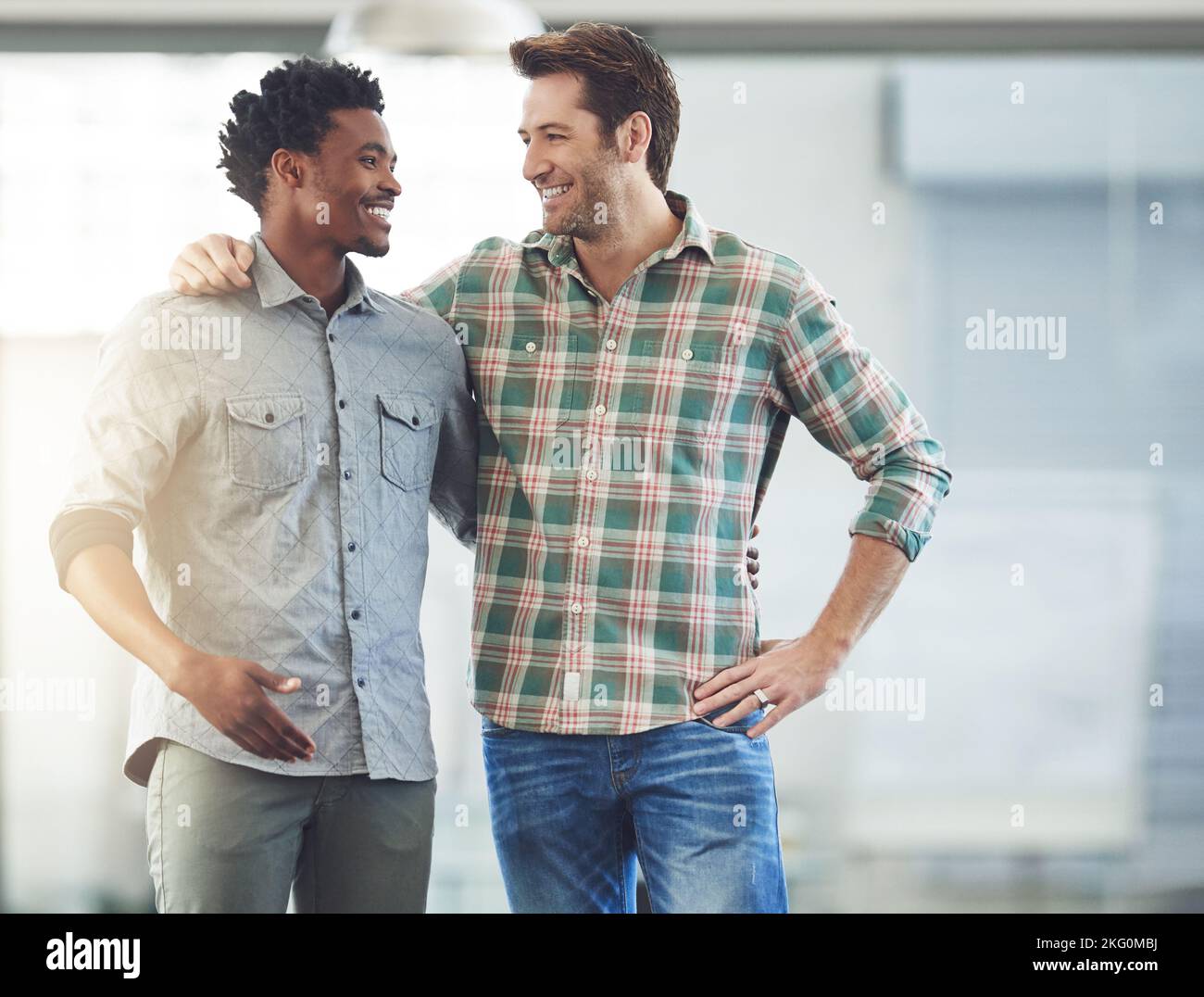 Sometimes colleagues make the best friends. two young male designers ...