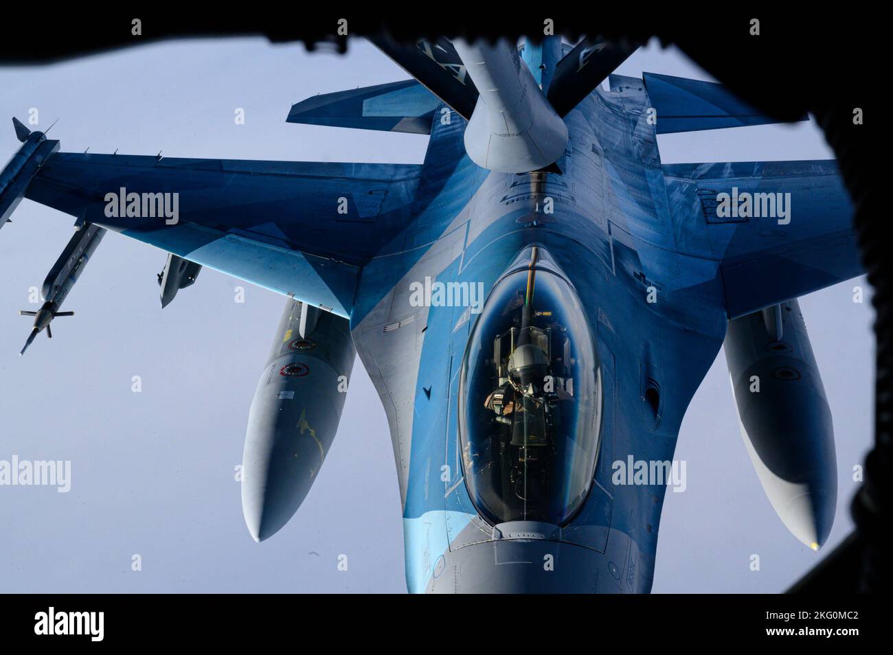 A U.S. Air Force F-16 Fighting Falcon receives fuel from the 168th Air ...