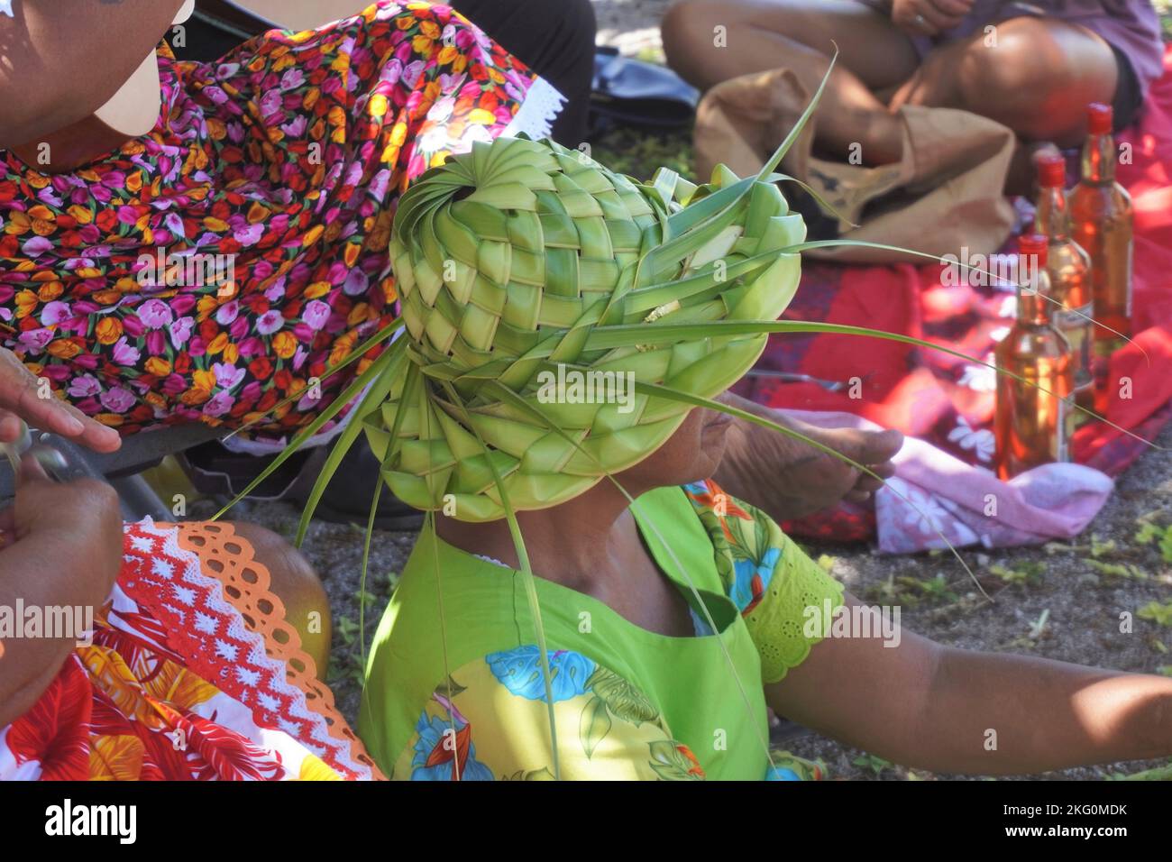 Headshot of a Polynesian Islander wearing a Green Hat made from Palm ...