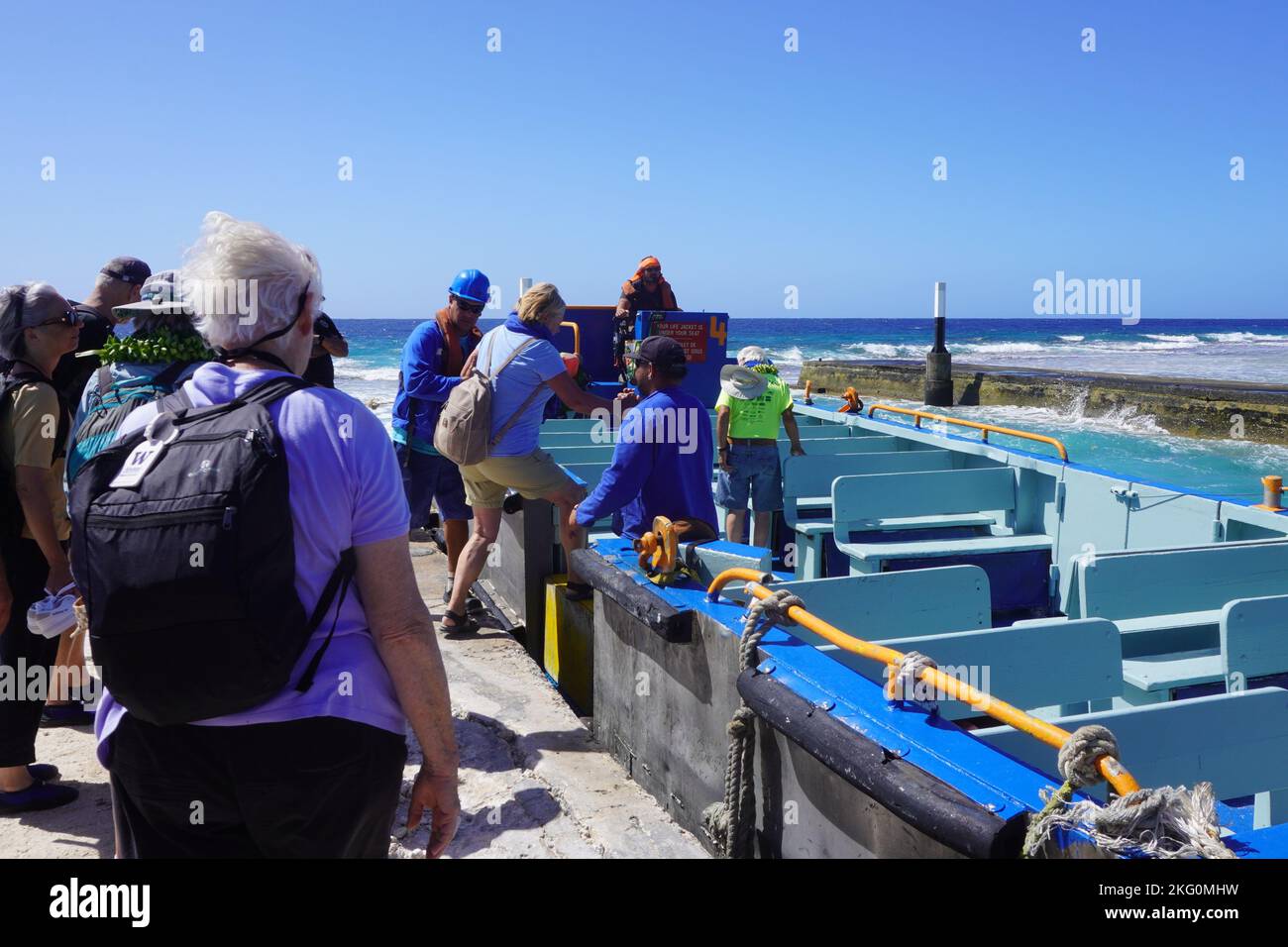 Cruise Passengers being helped into a Barge on Hikueru Atoll, French ...
