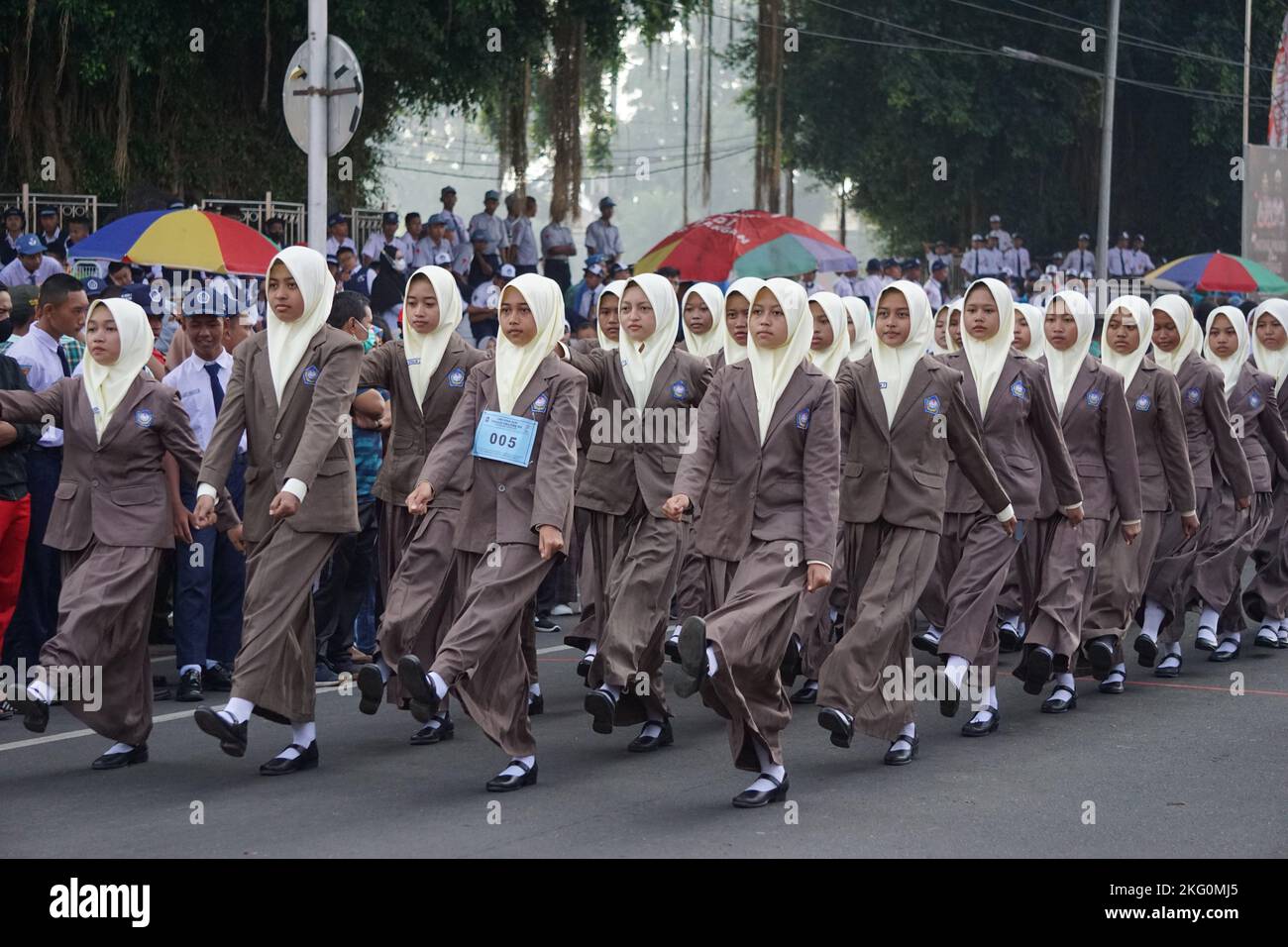Indonesian senior high school students with uniforms, marching to ...