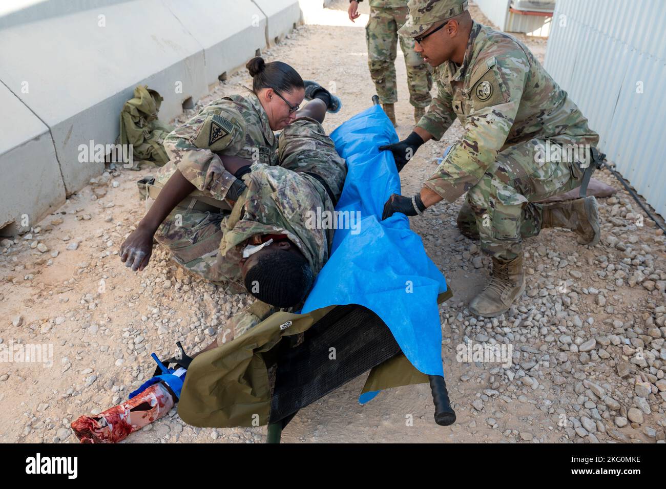 Soldiers assigned to Prince Sultan Air Base, place a training casualty ...