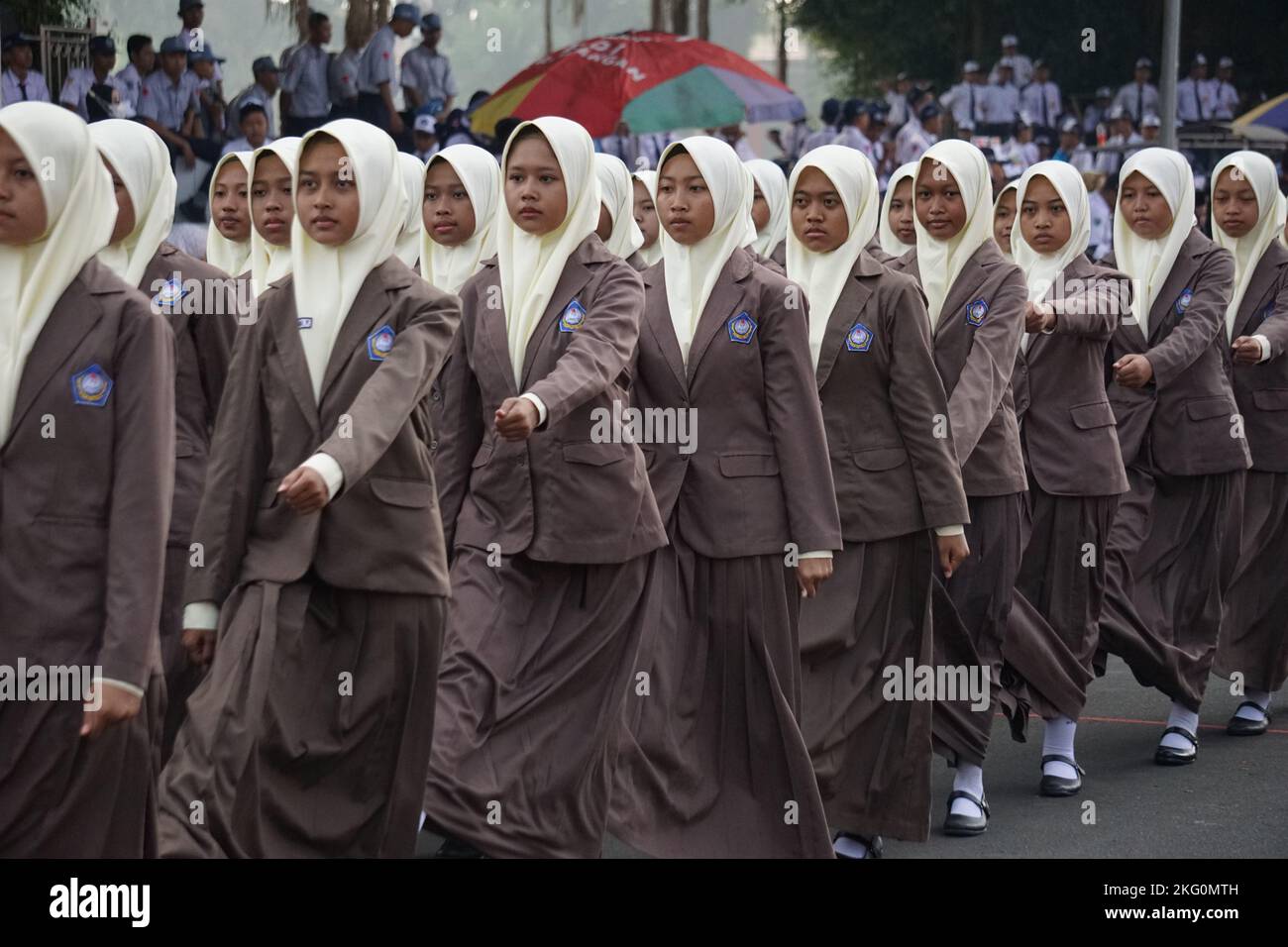 Indonesian senior high school students with uniforms, marching to ...