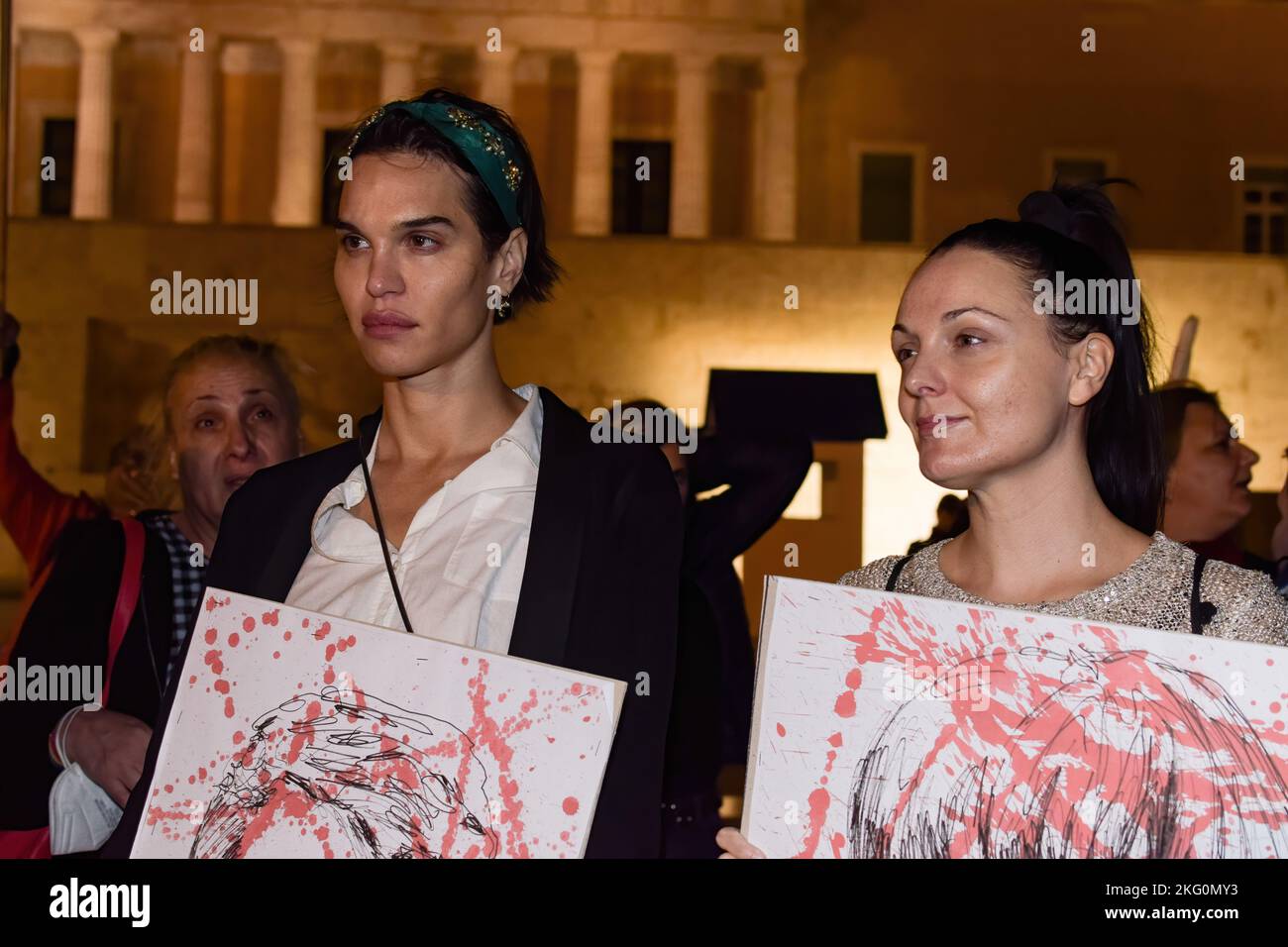Athens, Greece. 20 November 2022. Participants hold portaits of ...