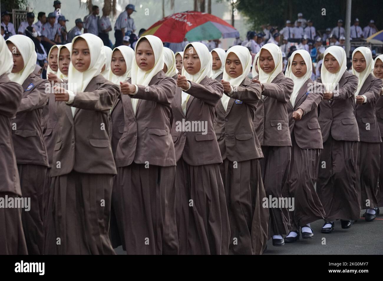 Indonesian senior high school students with uniforms, marching to ...