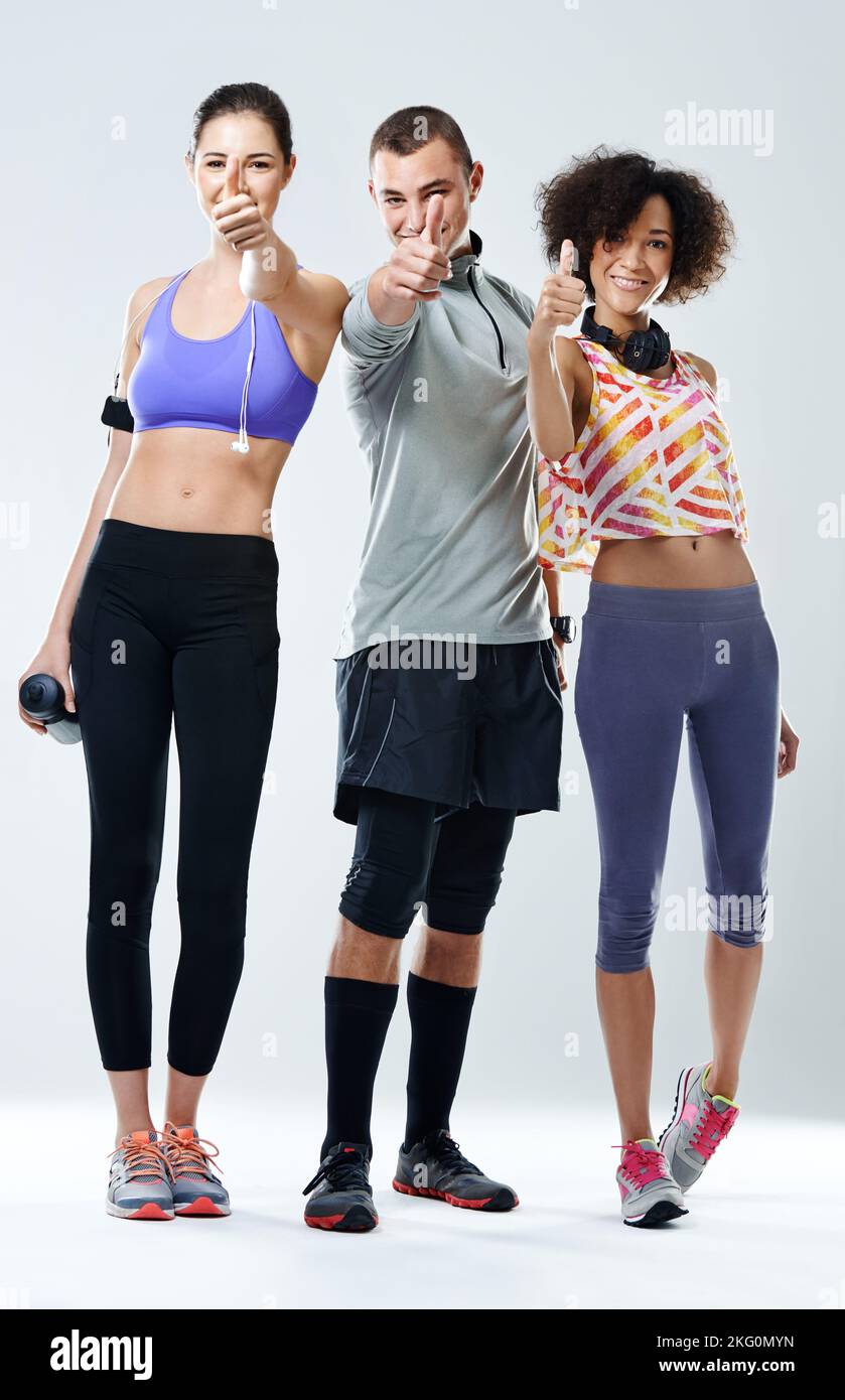 That workout was awesome. Three friends showing thumbs up while wearing ... That workout was awesome. Three friends showing thumbs up while wearing ...