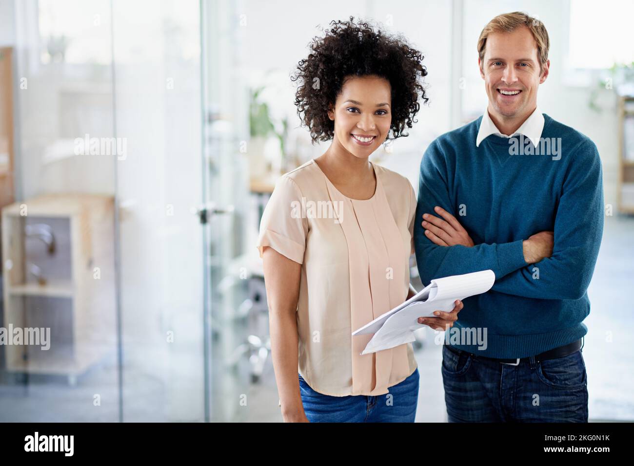 Designer duo. two colleagues enjoying a day at the office Stock Photo ...
