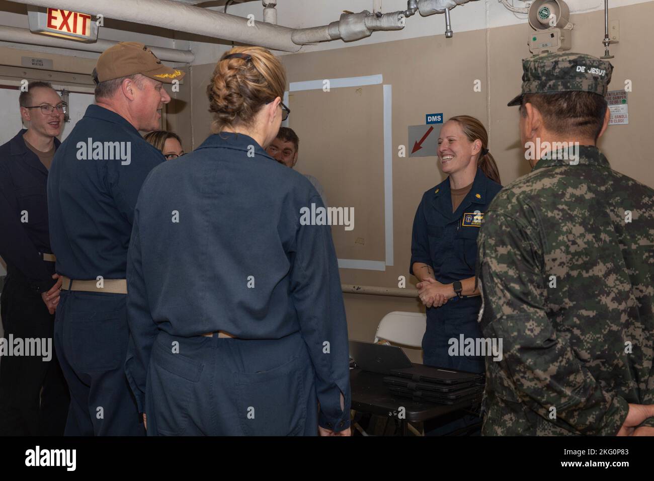 Lt. Cmdr. Michelle Lane, a microbiologist on board, speaks to ...