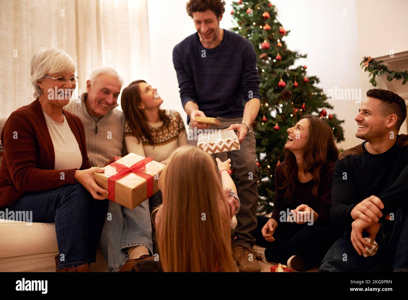 Christmas, happy and gift with family in living room for for ...