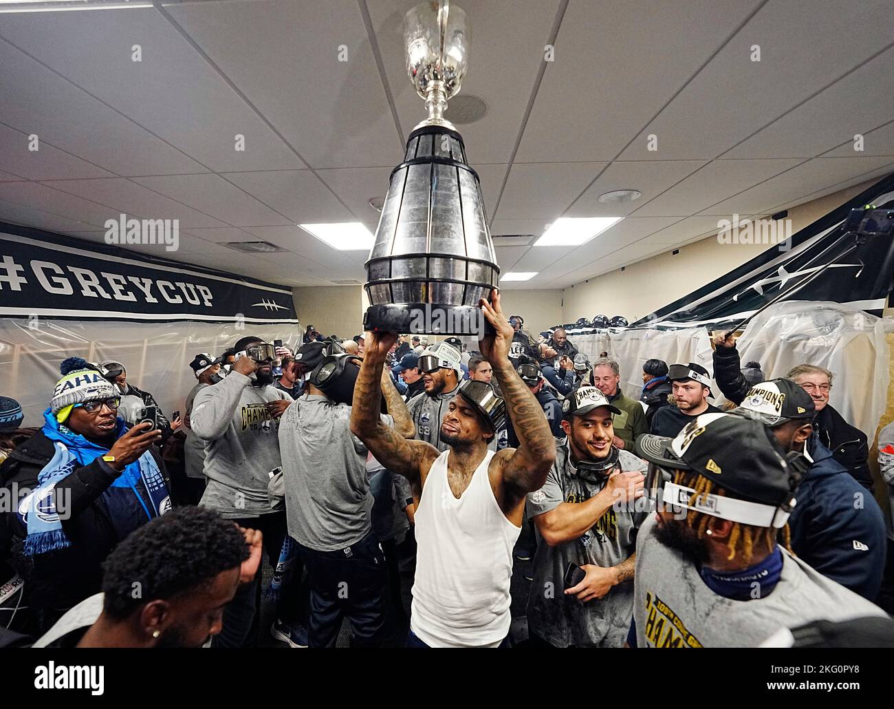 Members of the Toronto Argonauts celebrate in the locker room after ...
