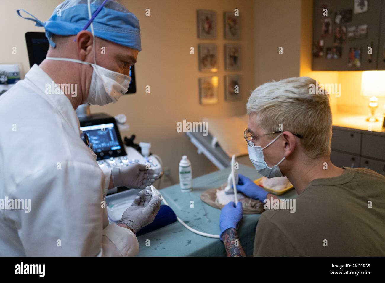 U.S. Air Force Maj. (Dr.) Christopher Sanders, left, 60th Medical ...