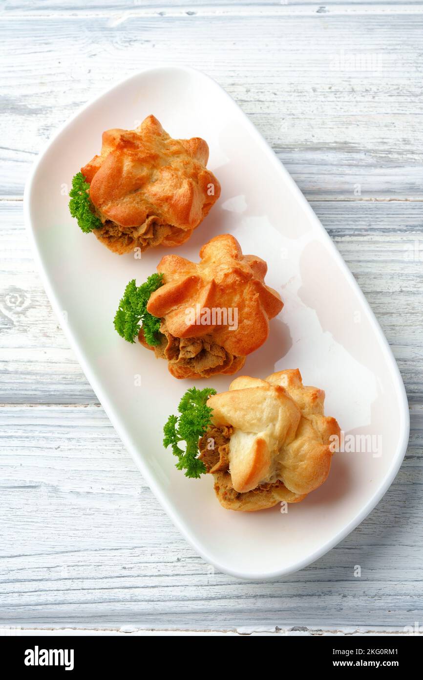 Profiteroles stuffed with soft mousse banquet food snacks Stock Photo ...