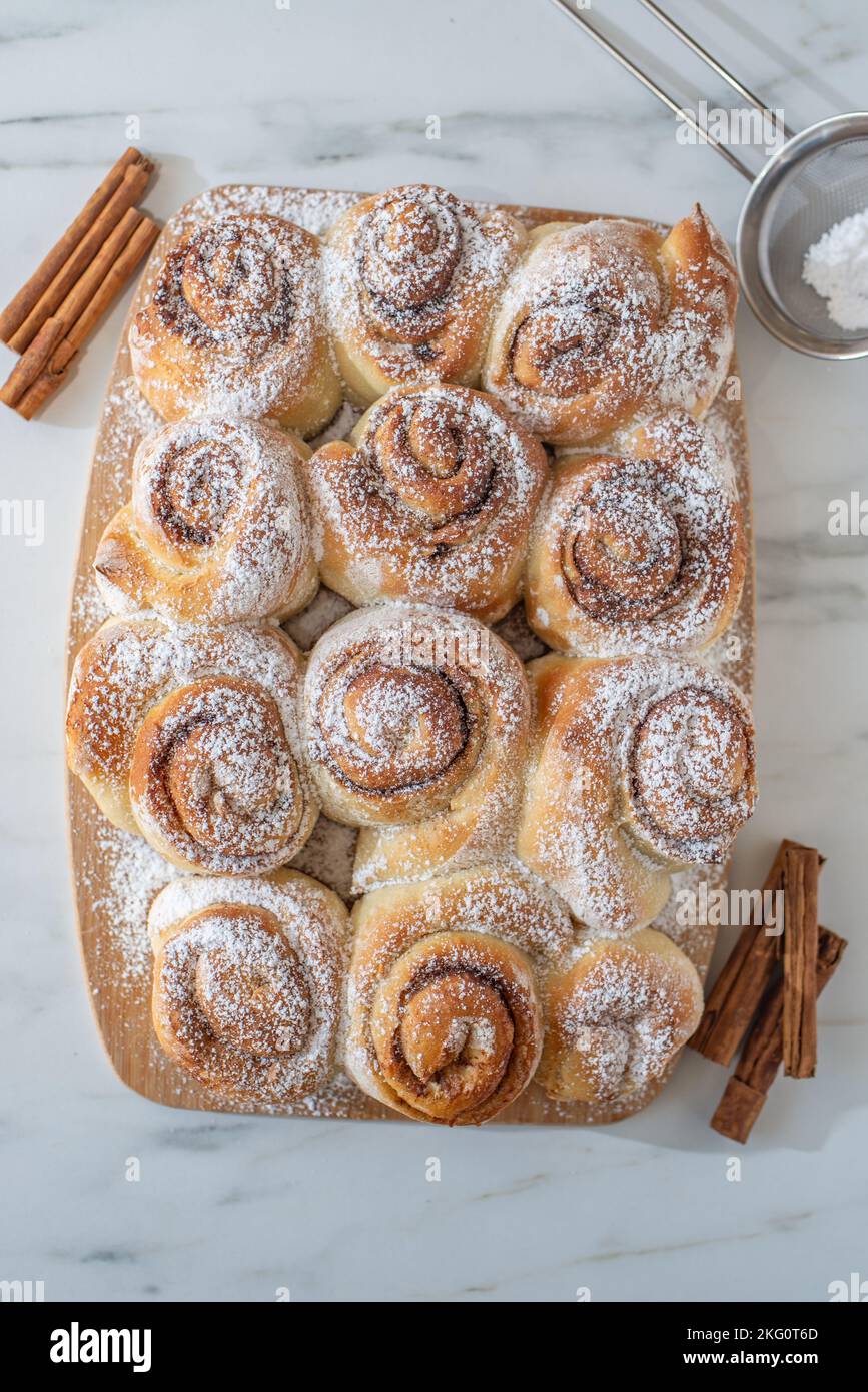 Cinnamon buns. Beautiful fresh cinnamon rolls on a table Stock Photo ...
