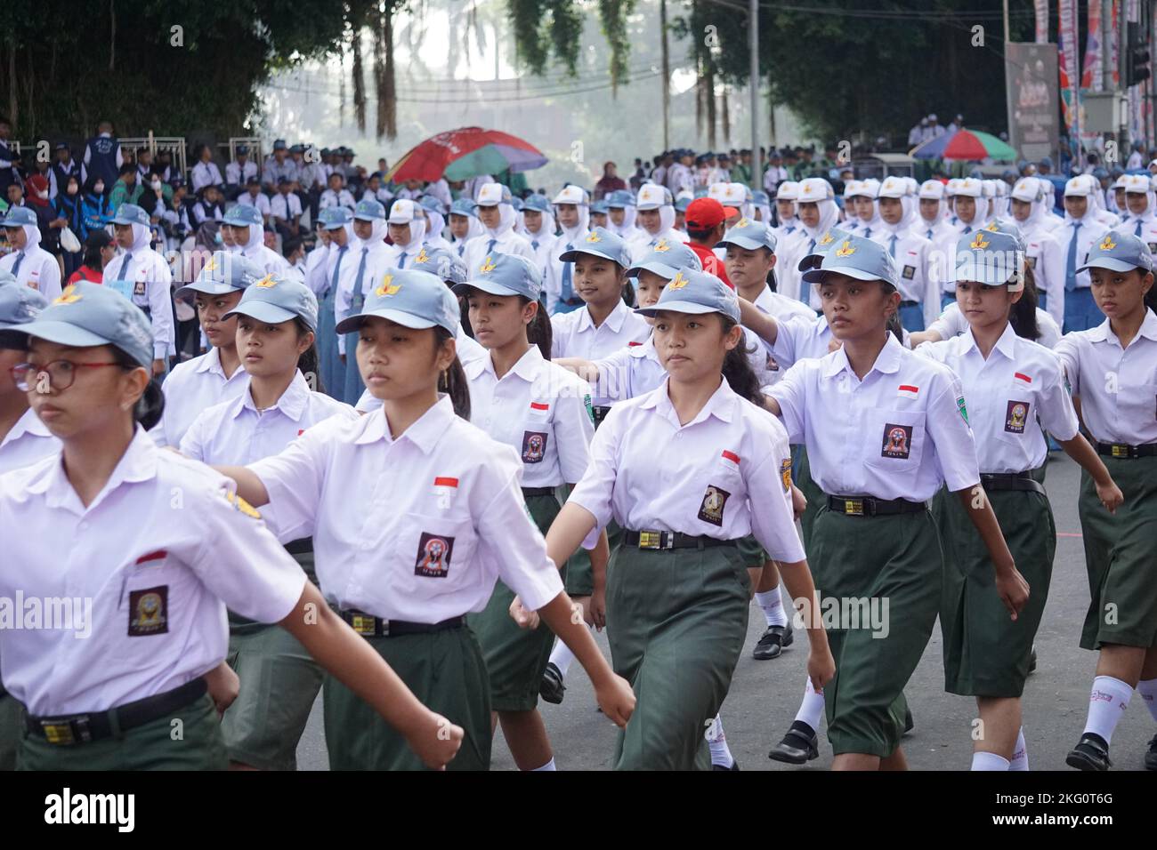 Indonesian senior high school students with uniforms, marching to ...