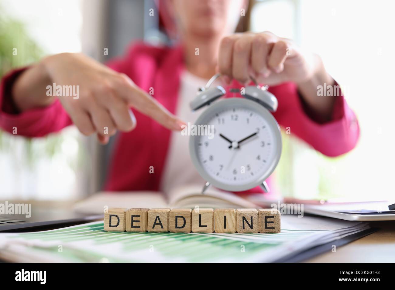 Female manager pointing alarm hi-res stock photography and images - Alamy