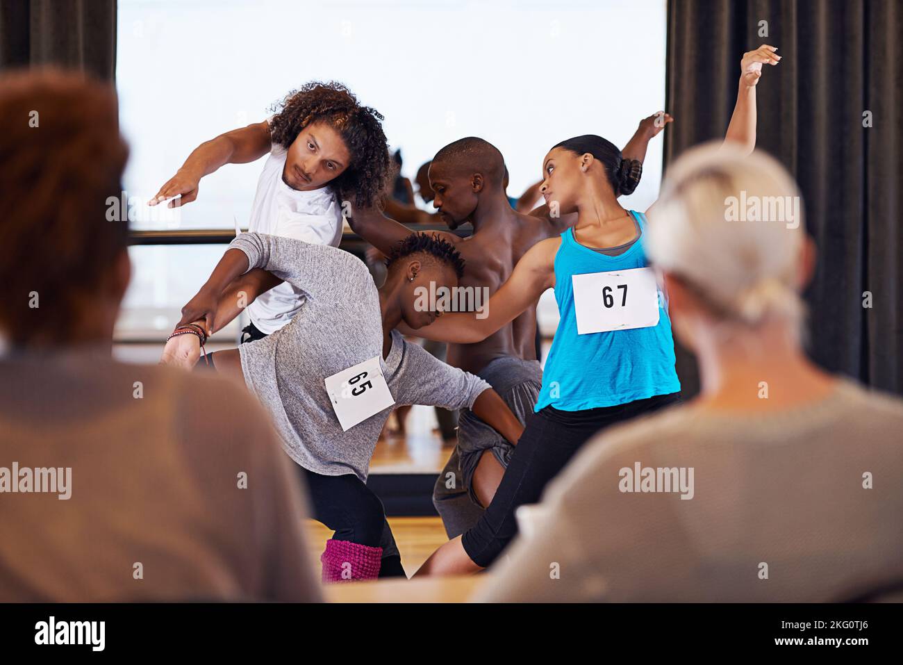 Dancing as one. a group of young dancers performing before the judges ...