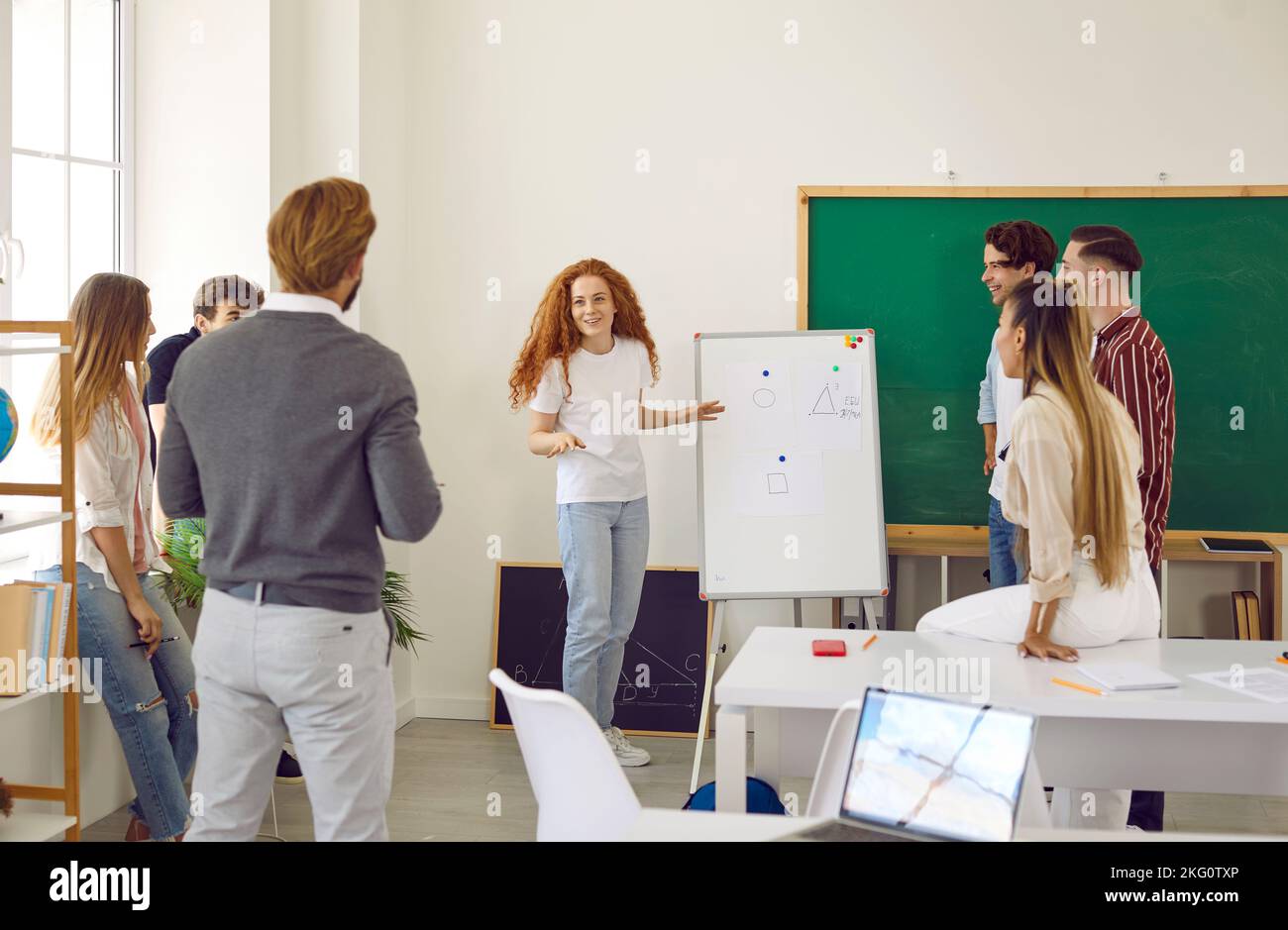 Team listens report of classmates, which shows research statistics in ...
