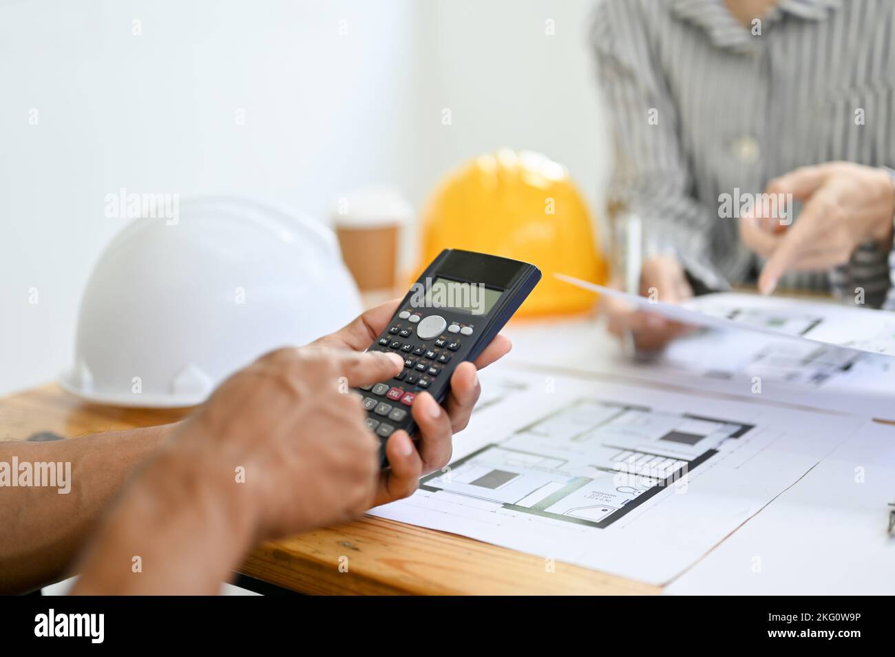 Professional Asian male construction engineer using a scientific ...