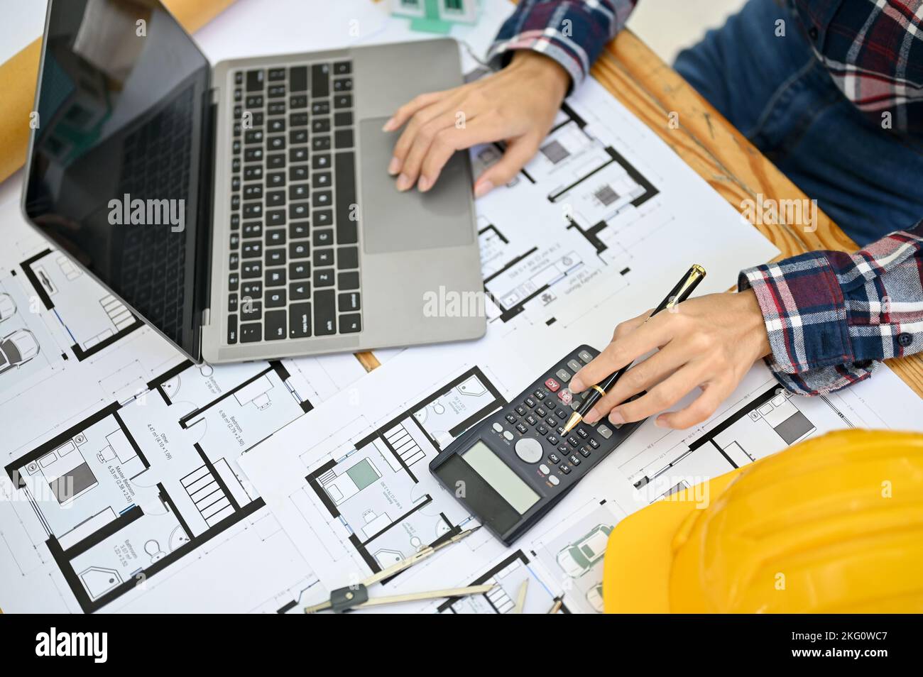 Top view, A professional female architect or engineer working at her ...