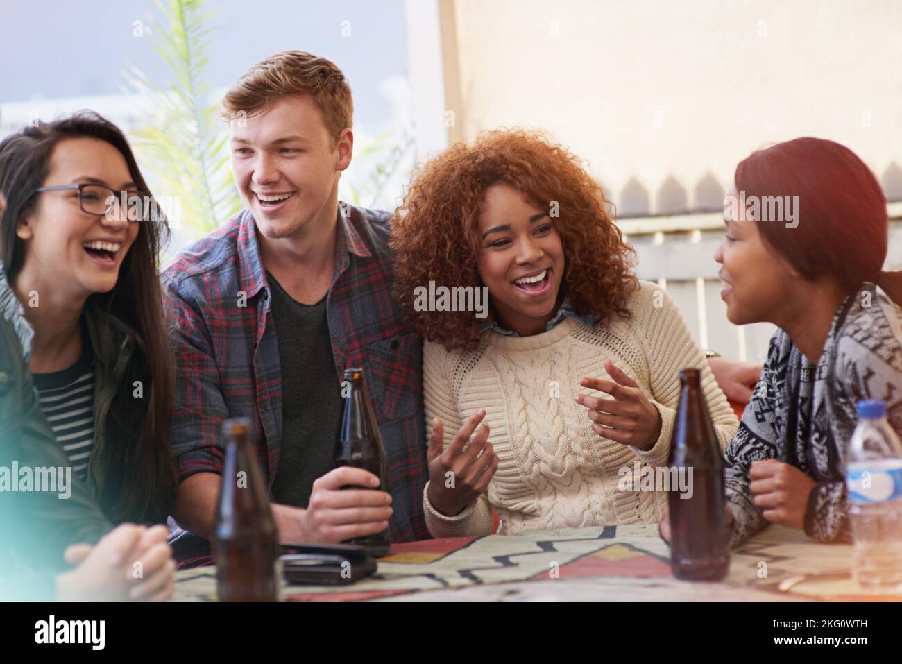 Having some friends over for drinks. a group of friends drinking ...
