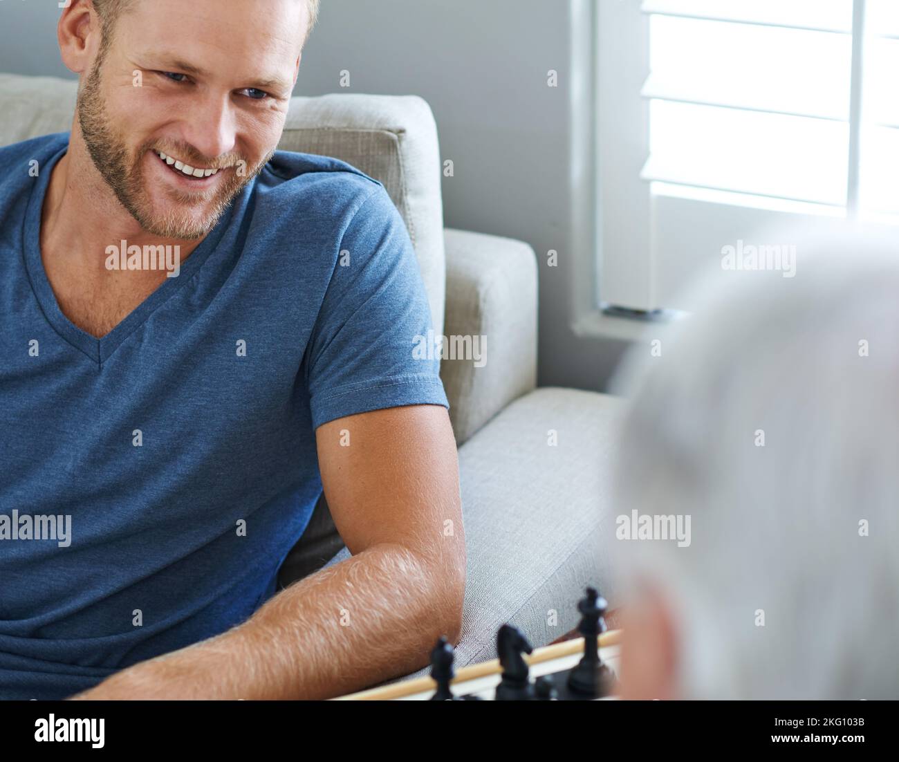 That was a great game of chess, Dad. a father and son playing a game of ...