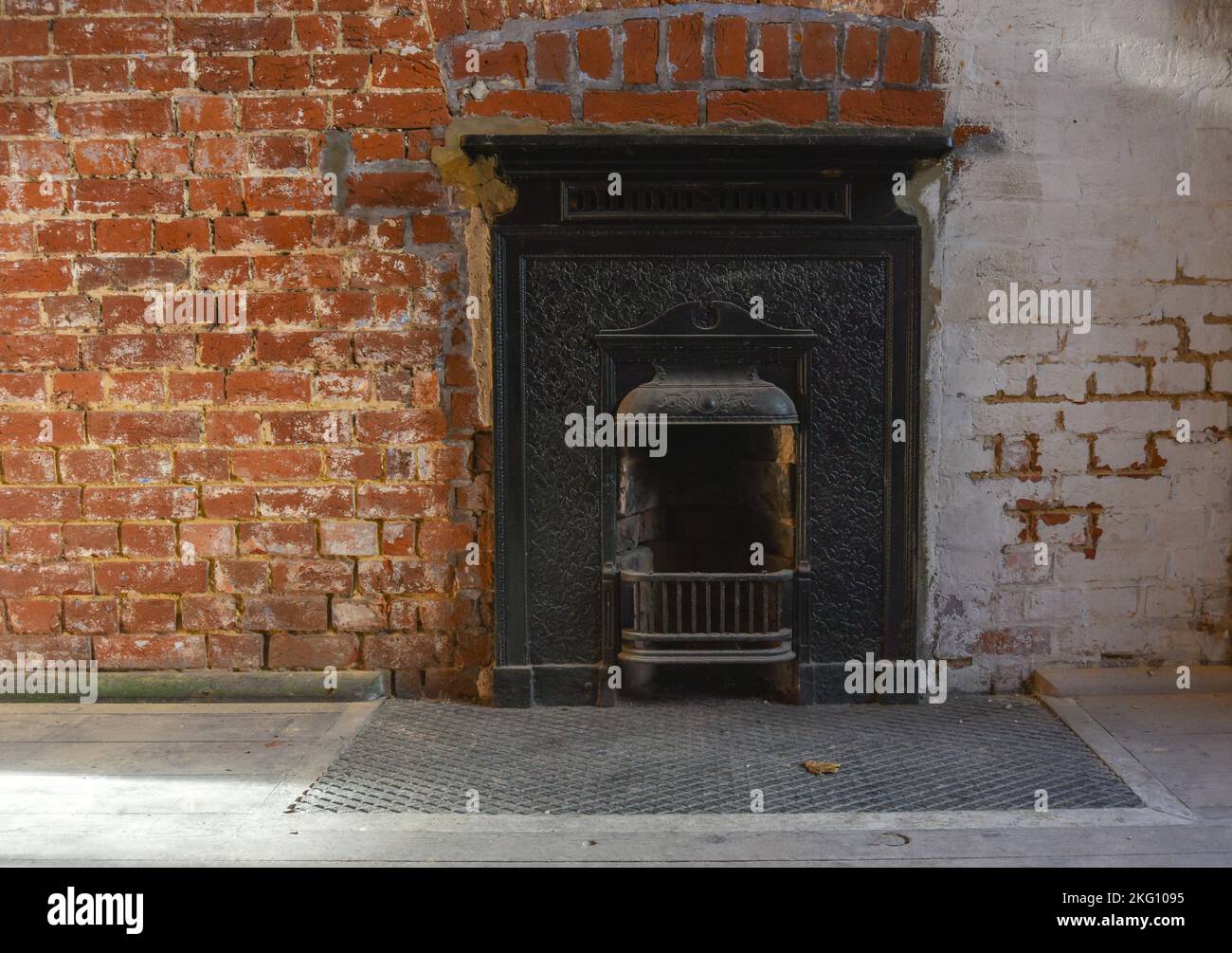 Victorian style open fireplace with red brick wall surround Stock Photo ...