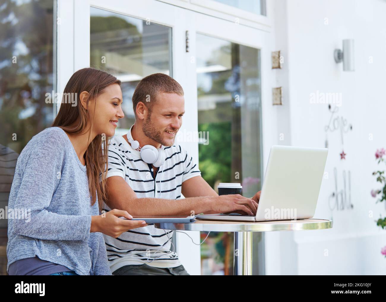 Connected to everything from anywhere. a happy young couple working ...