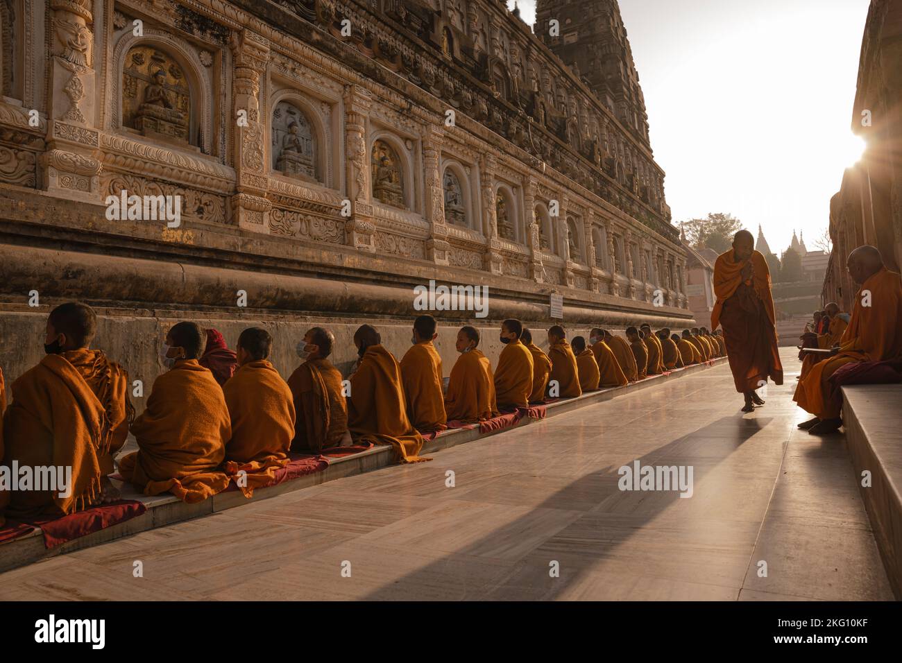 The Buddhist monks praying at Mahabodhi Temple in Bodh Gaya at sunrise ...