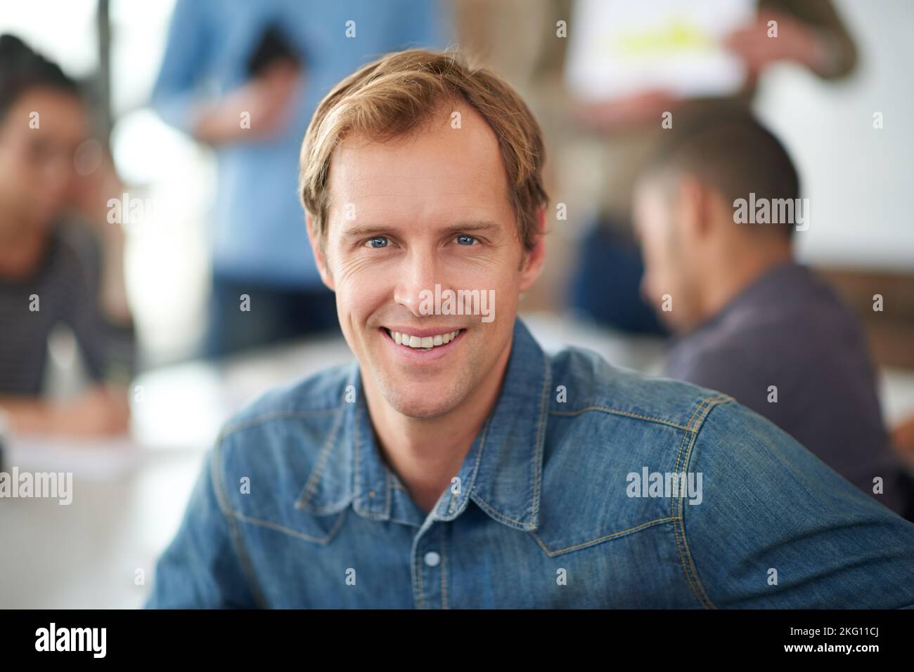 Young man behind table hi-res stock photography and images - Alamy