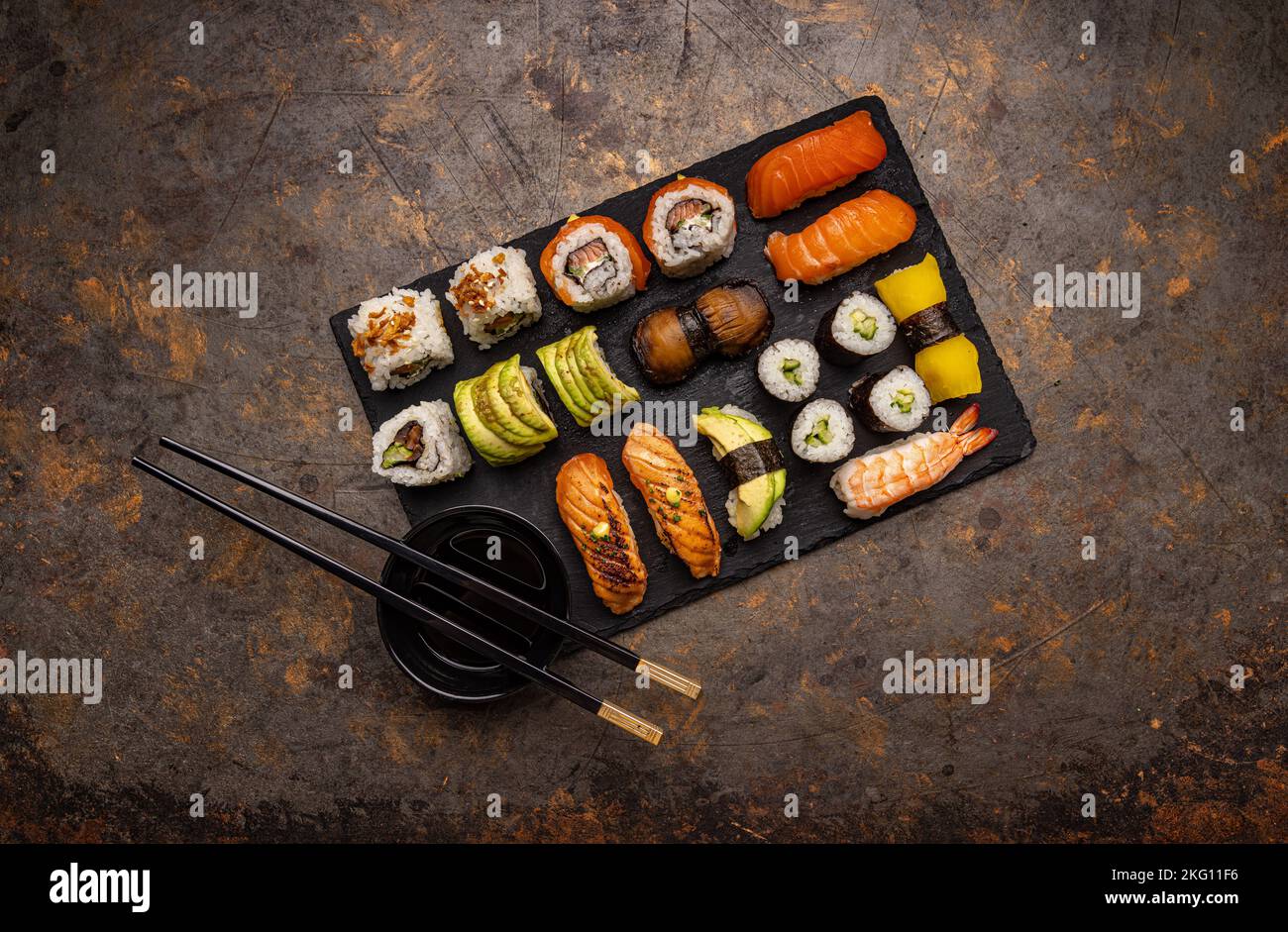 Japanese food concept. Sushi set menu on grunge background Stock Photo ...