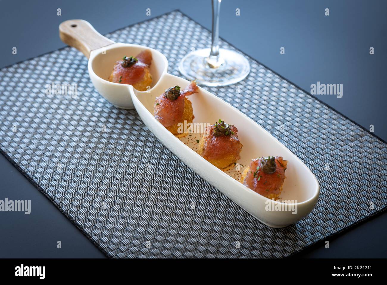 A closeup of delicious fish rolls amuse bouche served as appetizer in ...