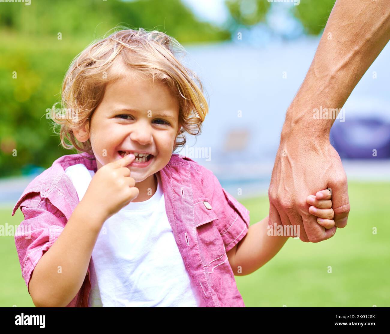 Planning the days mischief. Portrait of an adorable little boy holding ...