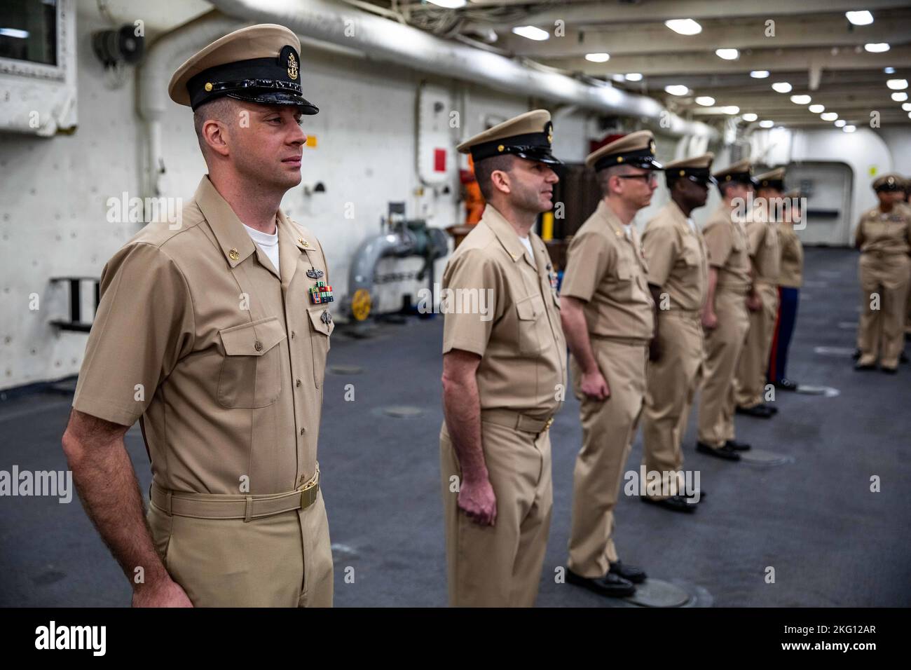 U.S. Navy Sailors and a U.S. Marine assigned to the San Antonio-class ...