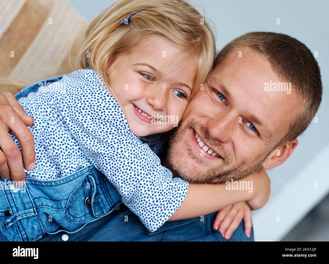 Hed do anything for her. Portrait of an adorable little girl hugging ...