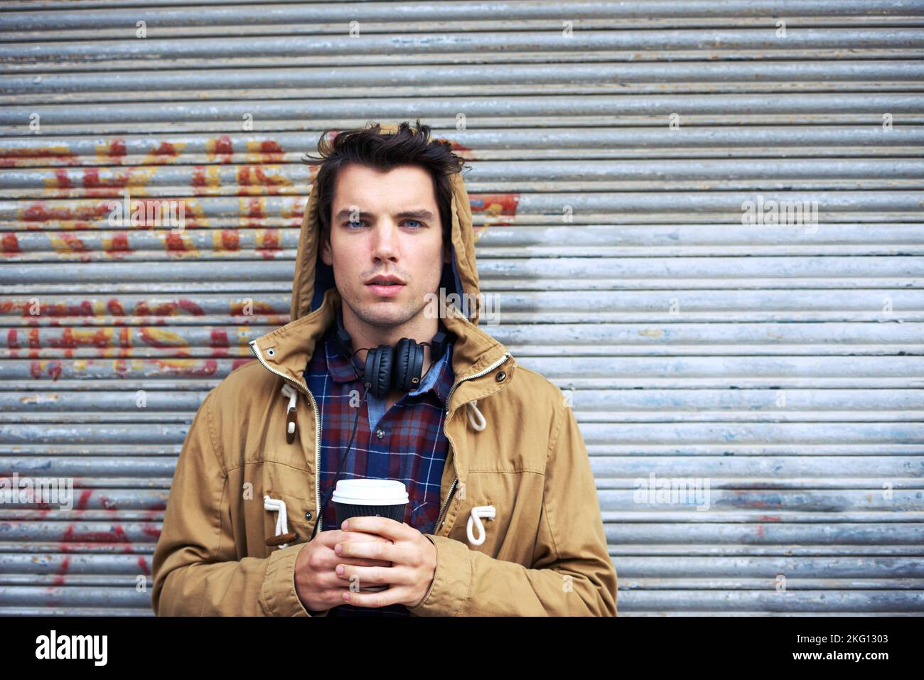 Out and about, around downtown. a handsome young man chilling in a ...