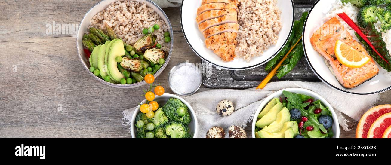 Table of various healthy food dishes. Healthy food assortment. Dieting ...