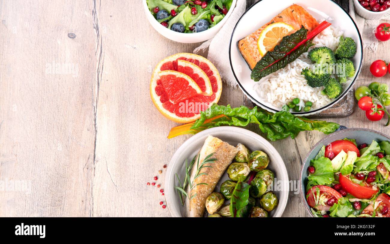 Table of various healthy food dishes. Healthy food assortment. Dieting ...