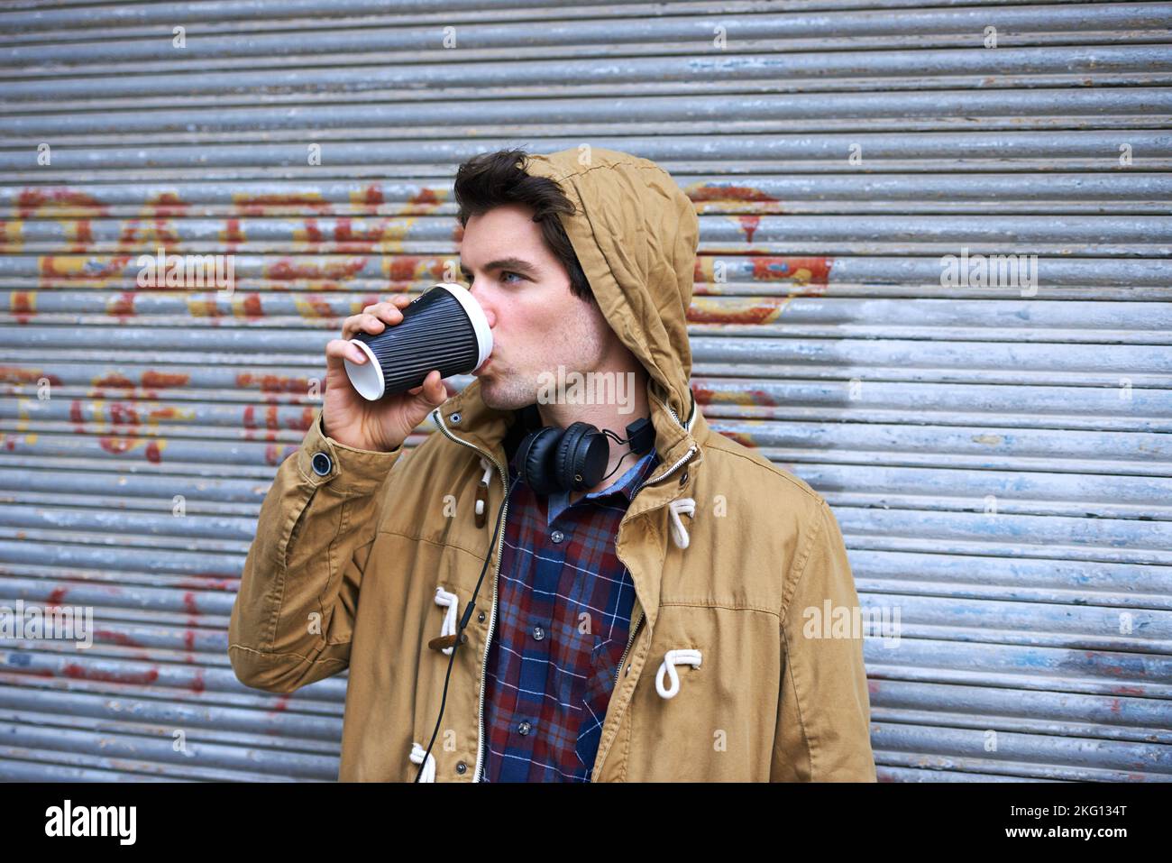 Out and about, around downtown. a handsome young man chilling in a ...