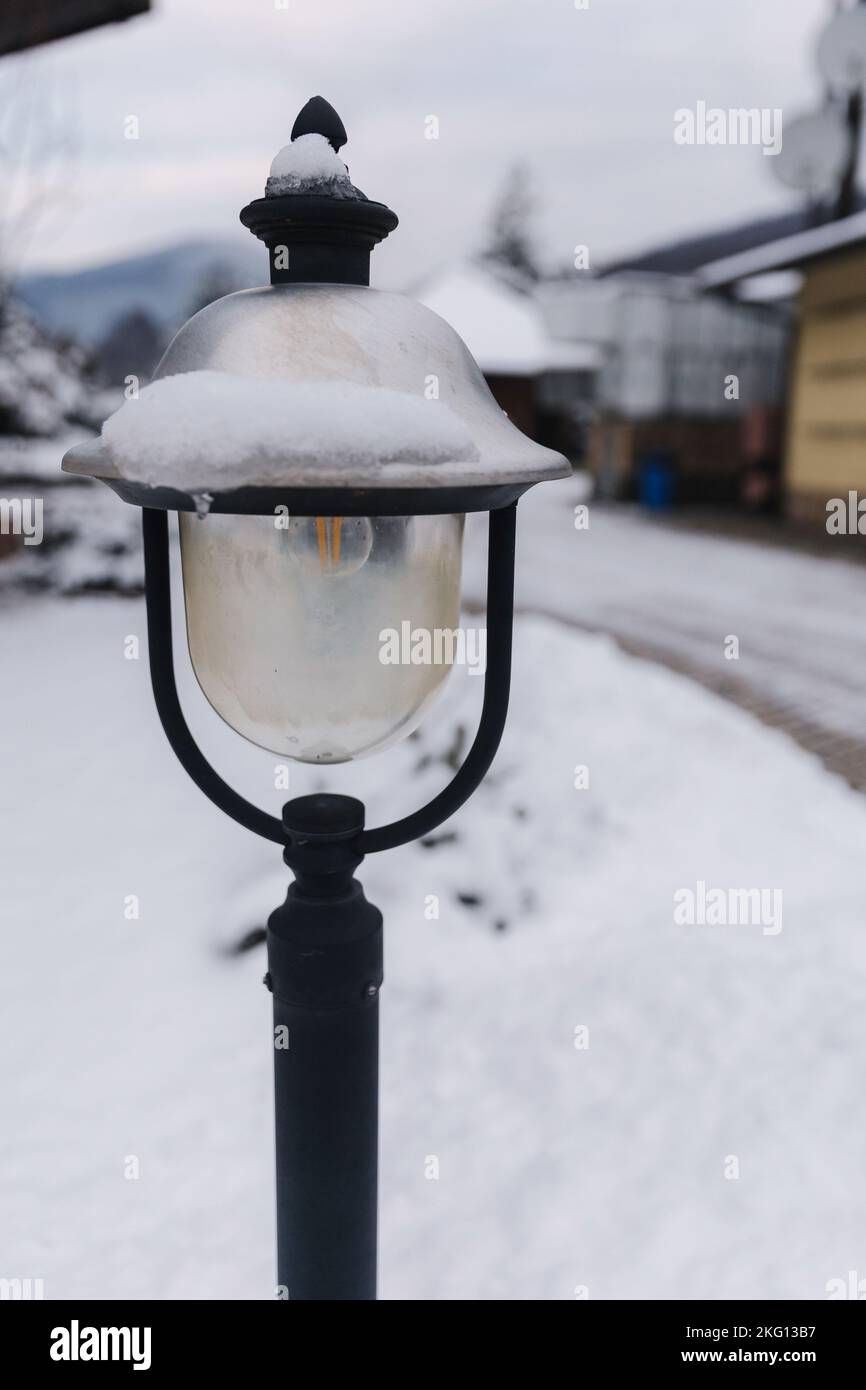 Street lamp covered with snow. Winter weather Stock Photo - Alamy