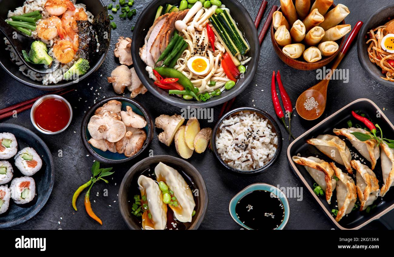 Traditional Asian food. Various of asian meals on dark background ...