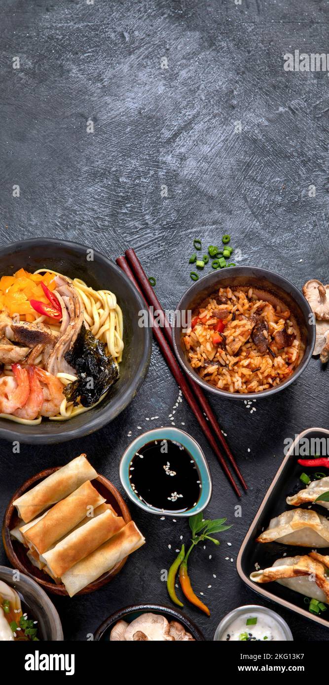 Traditional Asian food. Various of asian meals on dark background ...