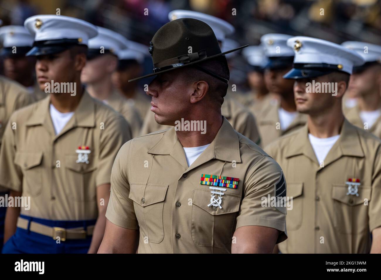 New U.S. Marines from Echo Company, 2nd Recruit Training Battalion, march across the parade deck ...